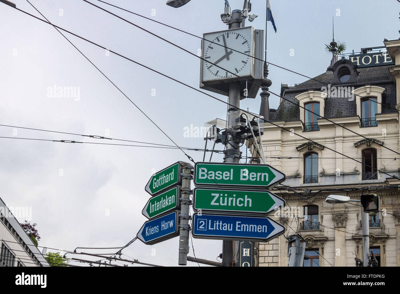 Street Clock and Information sign in Lucerne, Switzerland Stock Photo ...