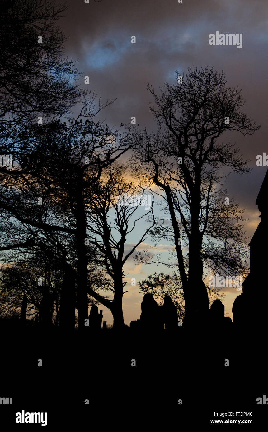 Graves at sunset Stock Photo - Alamy