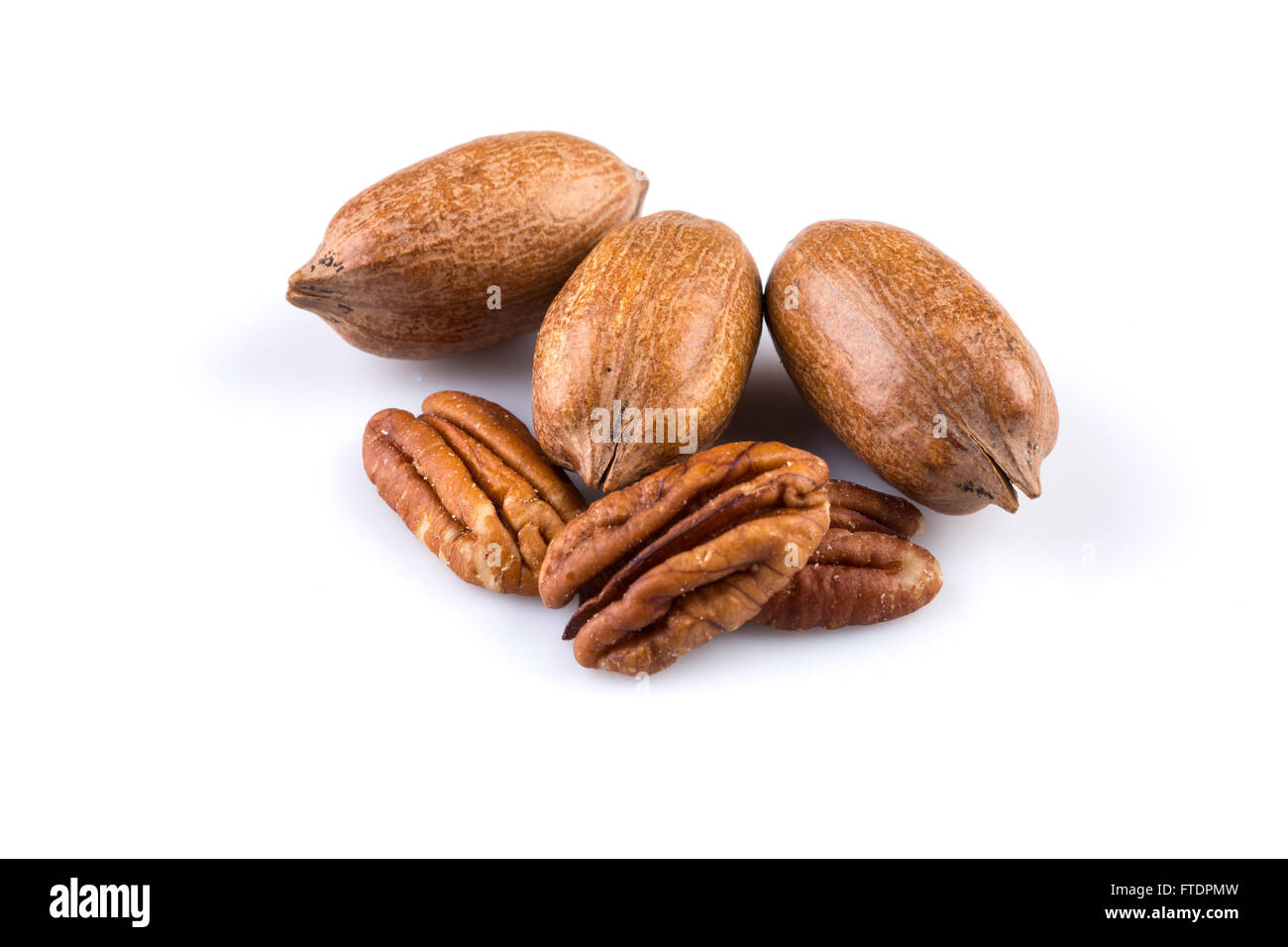 Few pecan nuts isolated on white background Stock Photo - Alamy