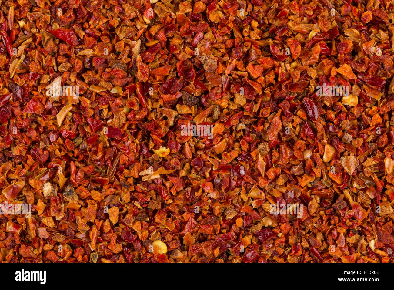Crushed red chili pepper for background texture Stock Photo - Alamy