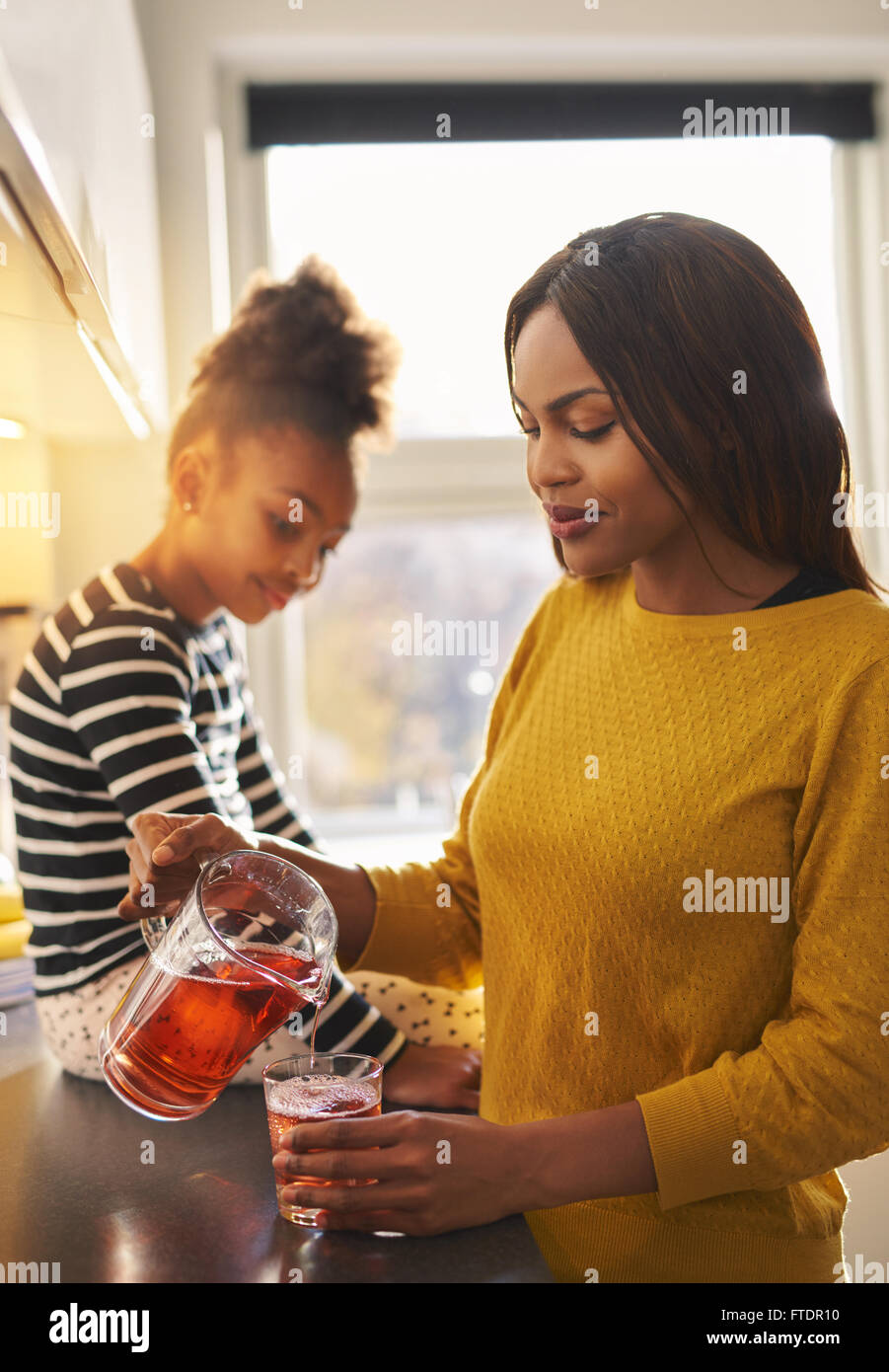 African girl drinking juice hi-res stock photography and images - Alamy