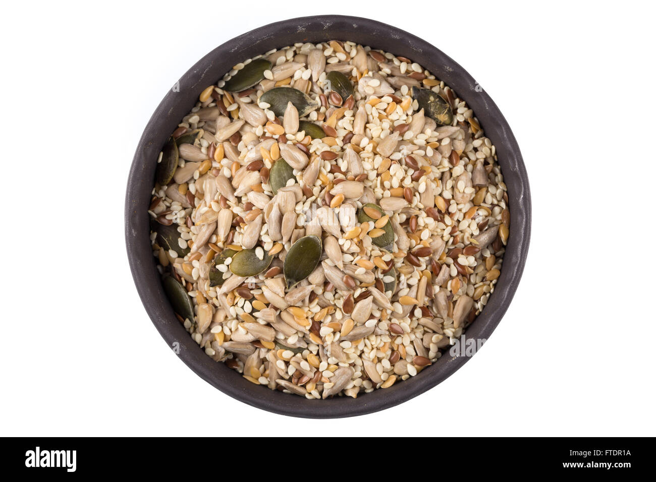 Healthy seeds mix in a stone bowl on white background Stock Photo - Alamy
