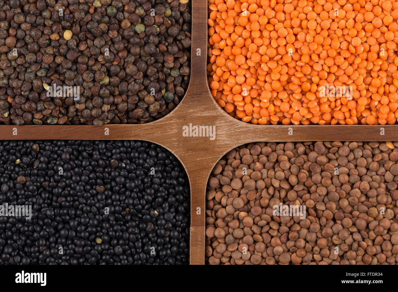 Four varieties of organic bio lentils in wooden bowls Stock Photo - Alamy
