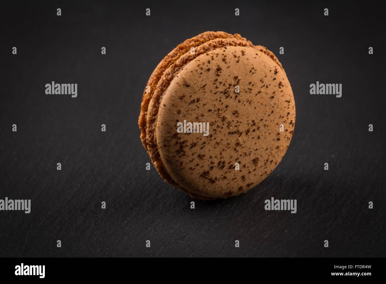 Colorful homemade chocolate macaroon on a dark background Stock Photo ...