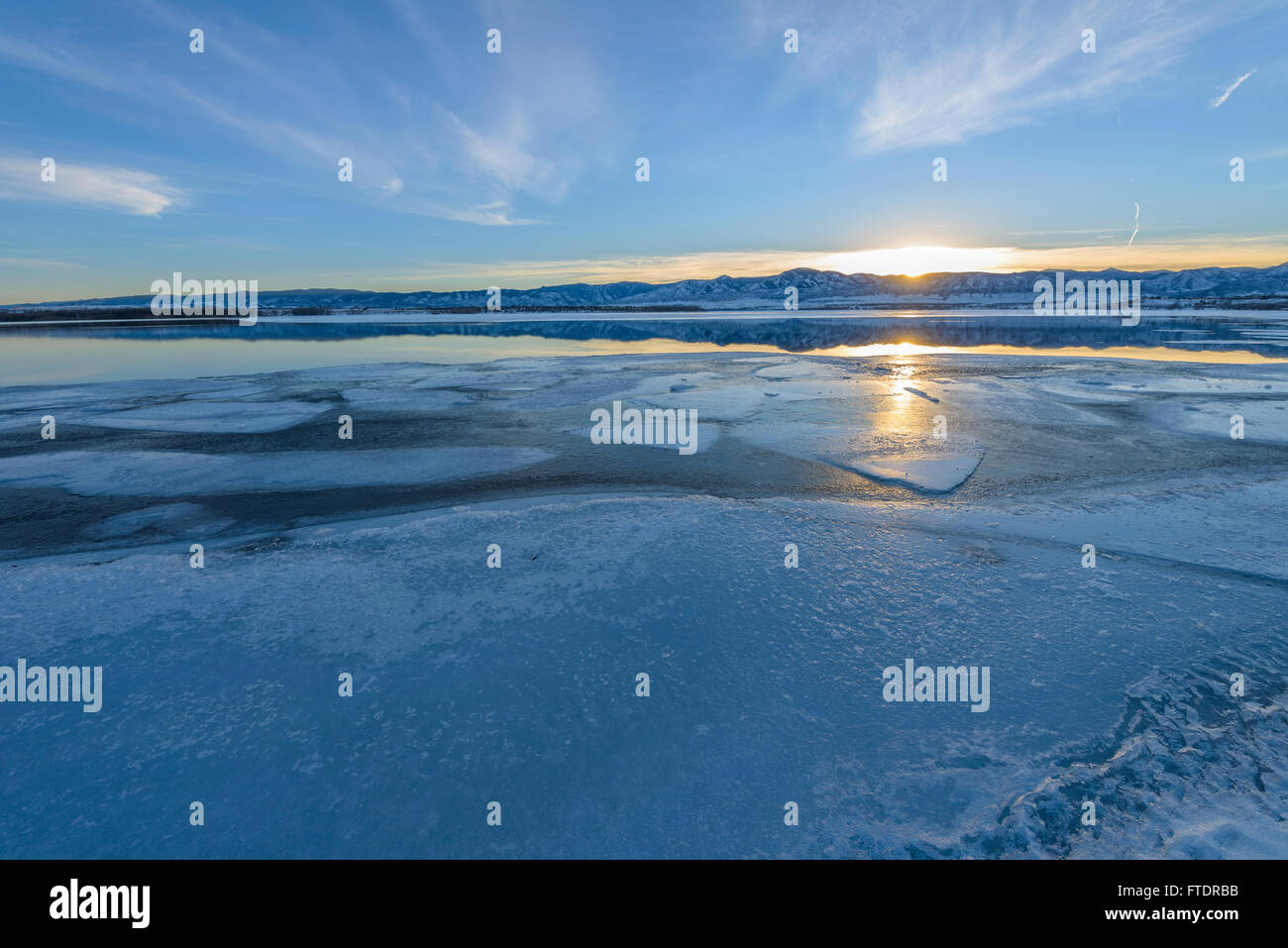Sunset Winter Mountain Lake - The sun sets on an icy cold mountain lake ...