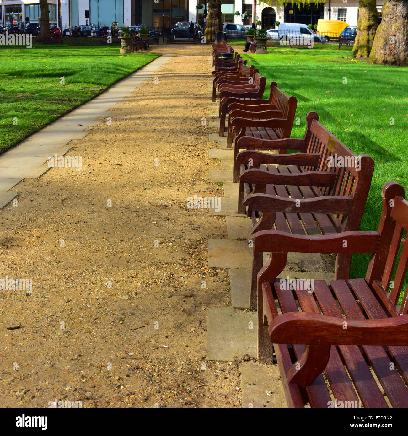 Benches along the main path in Berkeley Square, Mayfair, London Stock ...