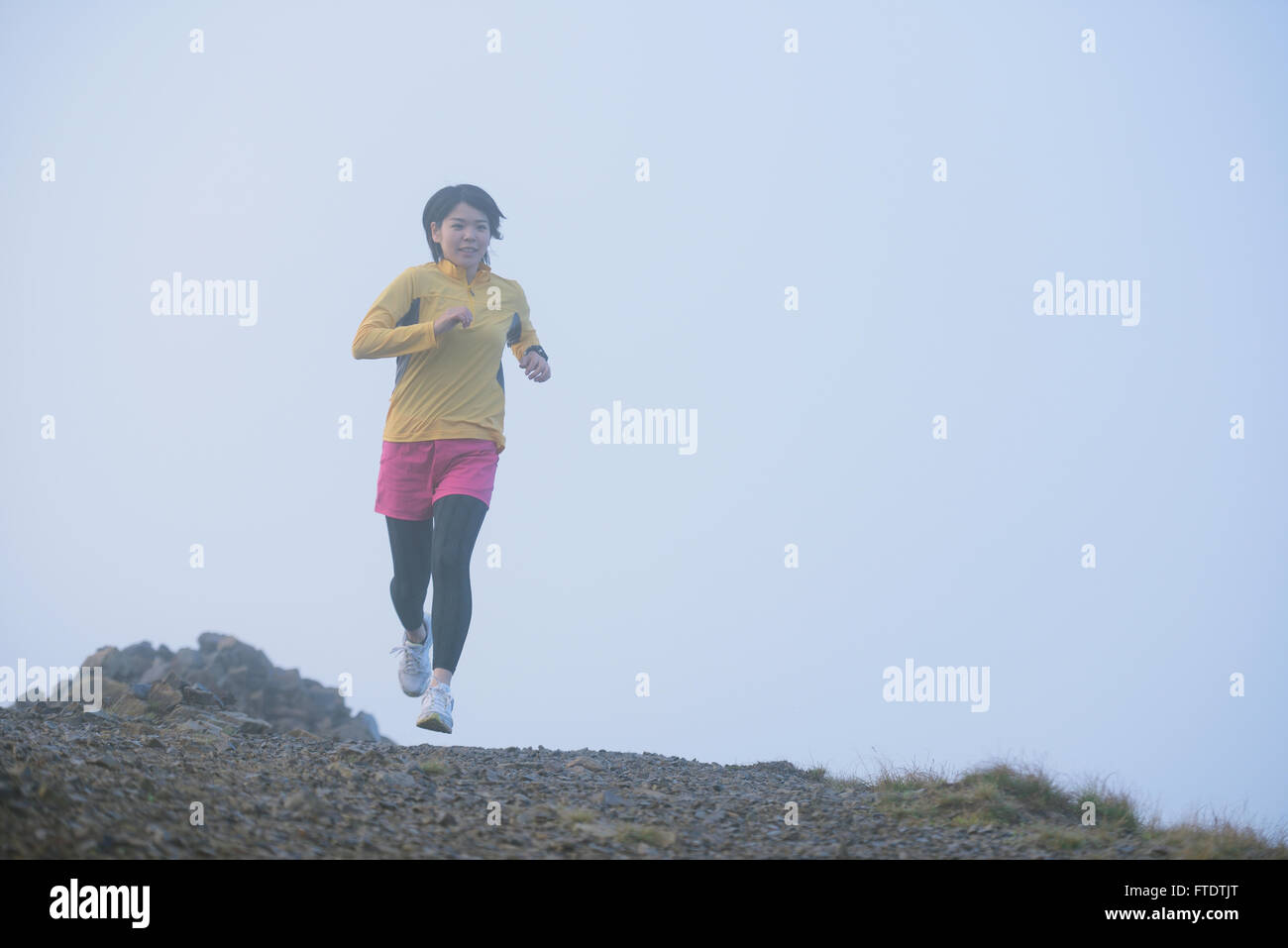 Young Japanese woman trail running at Mount Daibosatsu, Yamanashi ...