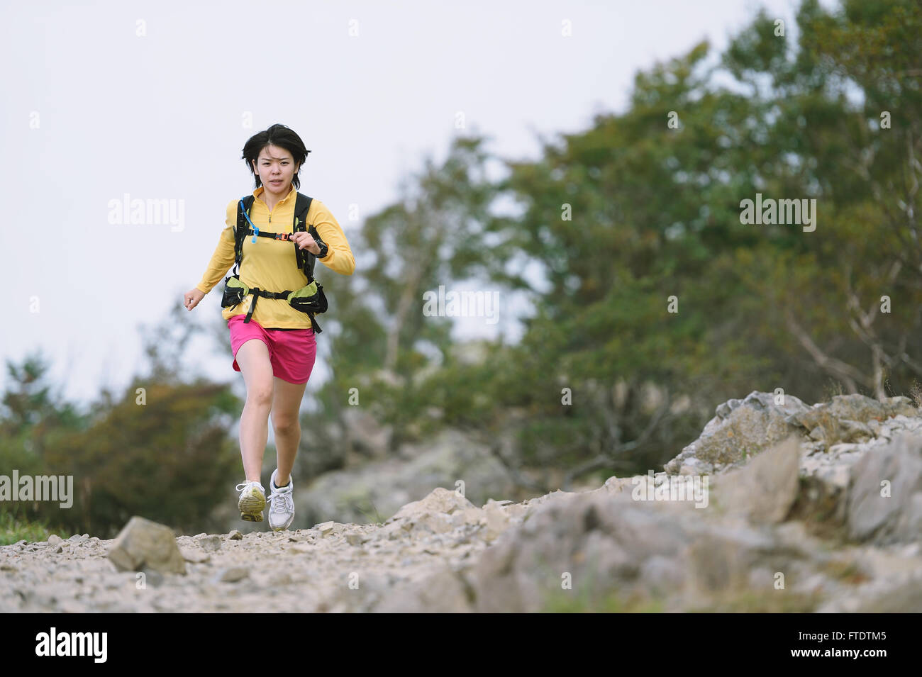 Young Japanese woman trail running at Mount Daibosatsu, Yamanashi ...