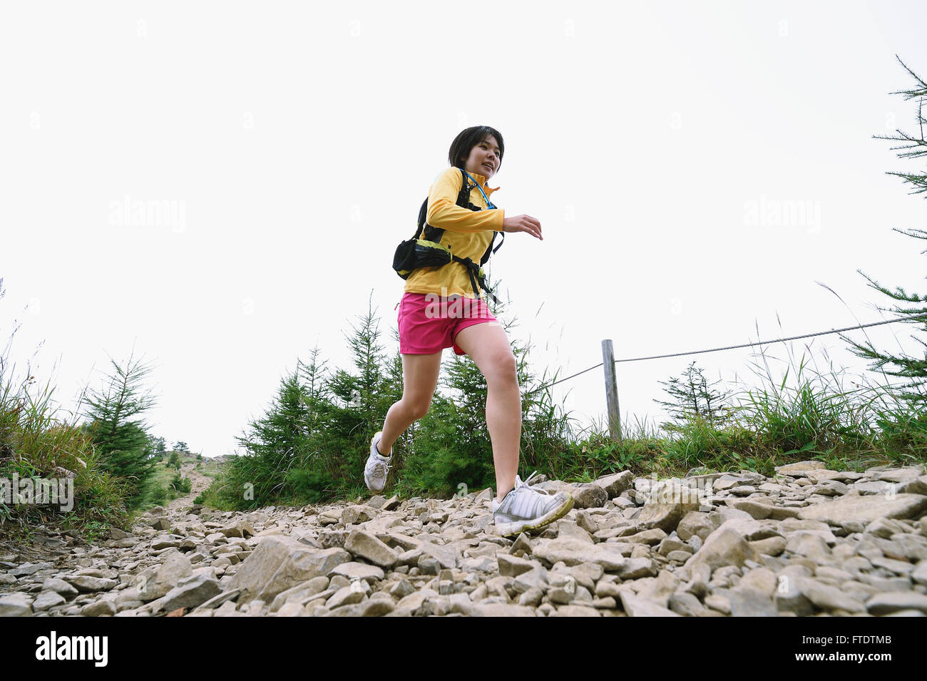 Young Japanese woman trail running at Mount Daibosatsu, Yamanashi ...