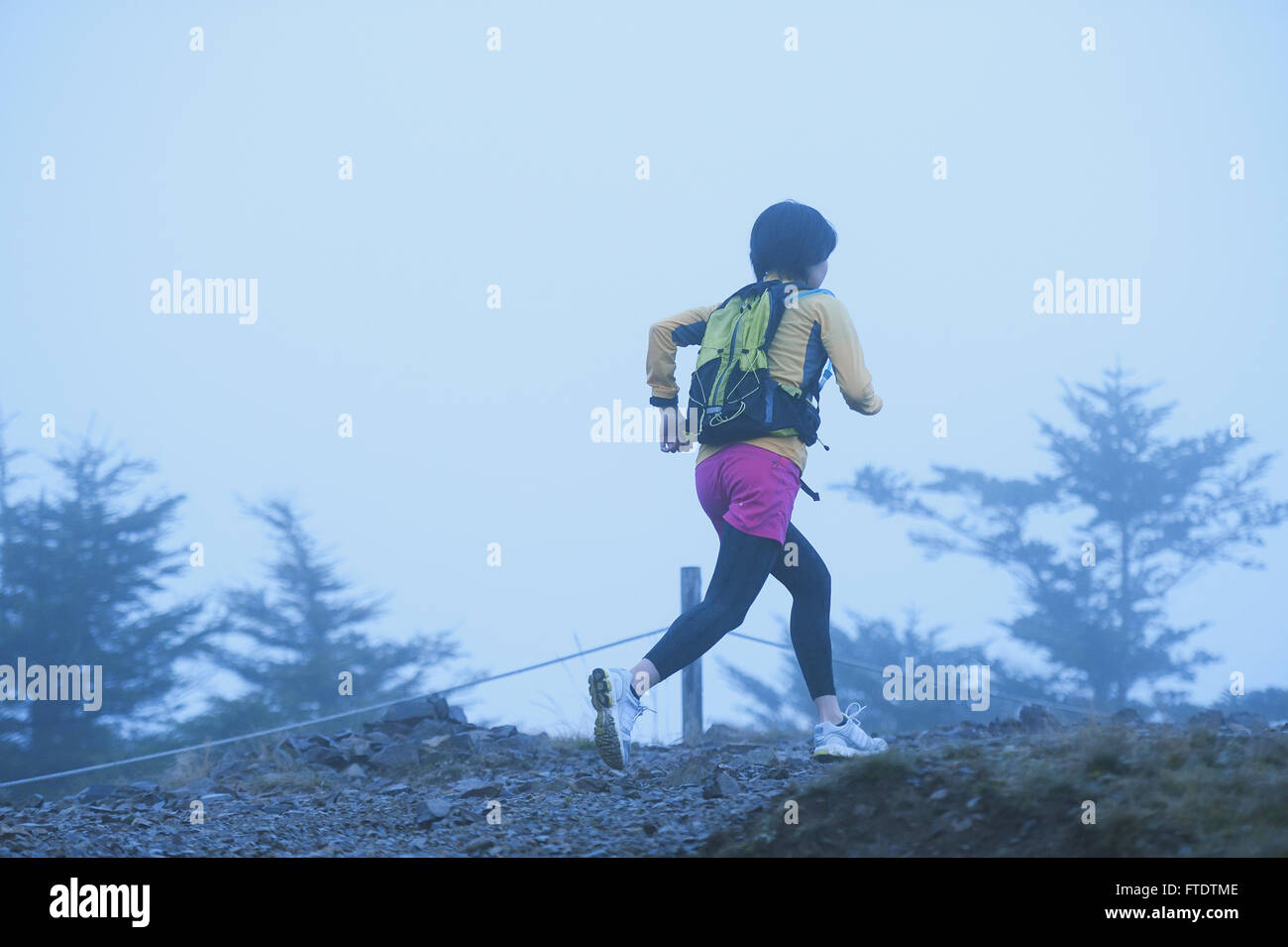 Young Japanese woman trail running at Mount Daibosatsu, Yamanashi ...