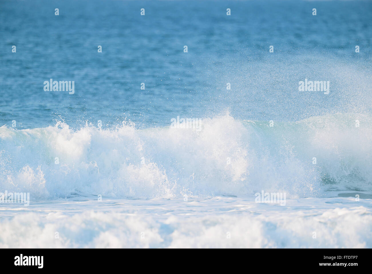 Crashing waves with people hi-res stock photography and images - Alamy