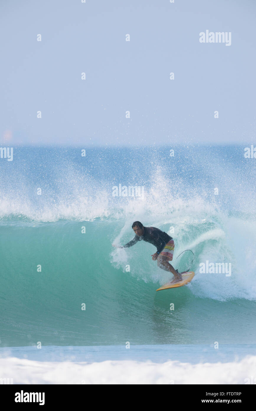Japanese surfer riding wave Stock Photo - Alamy