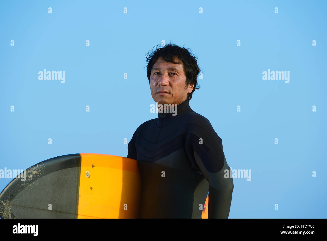 Japanese surfer portrait on the beach Stock Photo - Alamy