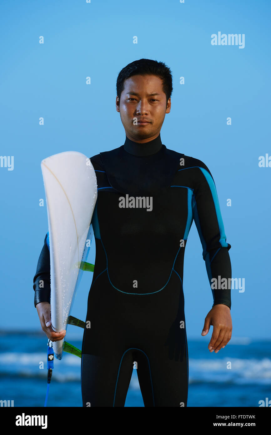 Japanese surfer portrait on the beach Stock Photo - Alamy