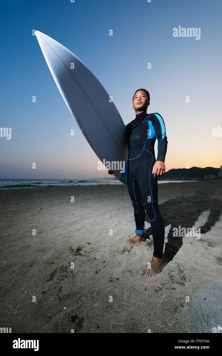 Japanese surfer portrait on the beach Stock Photo - Alamy