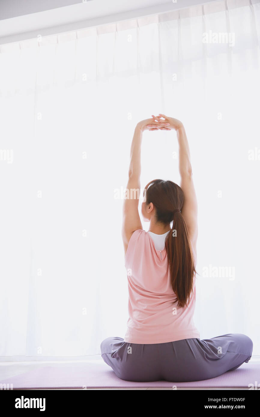 Young Japanese woman practicing yoga Stock Photo - Alamy