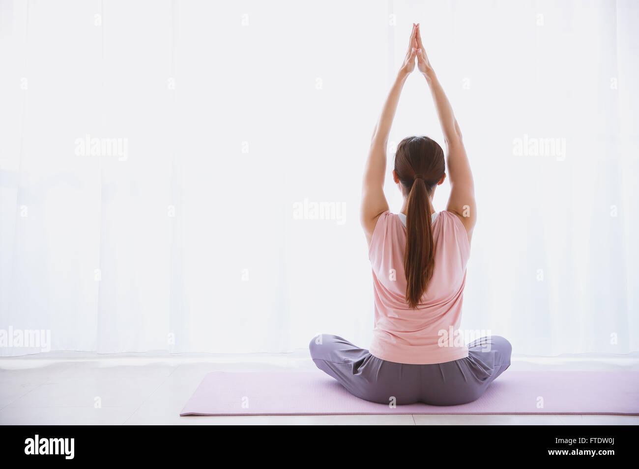 Young Japanese woman practicing yoga Stock Photo - Alamy
