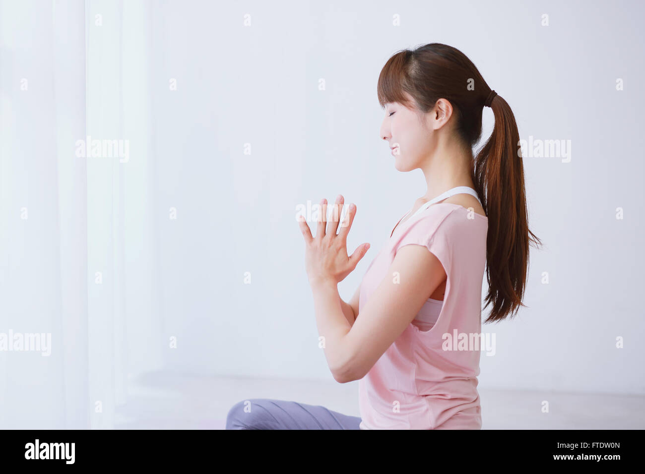 Young Japanese woman practicing yoga Stock Photo - Alamy