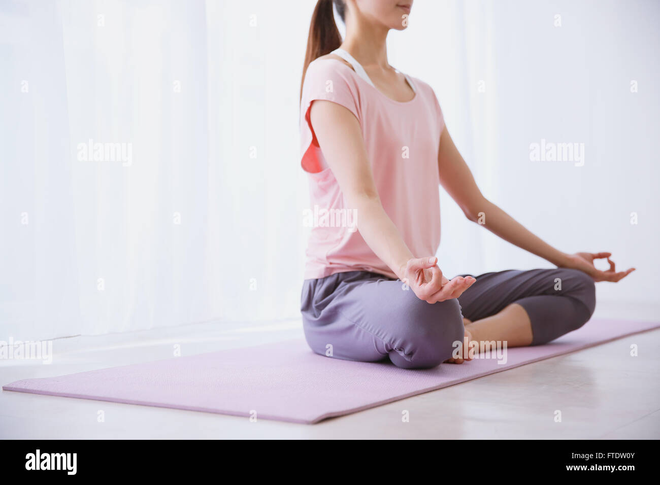 Young Japanese woman practicing yoga Stock Photo - Alamy