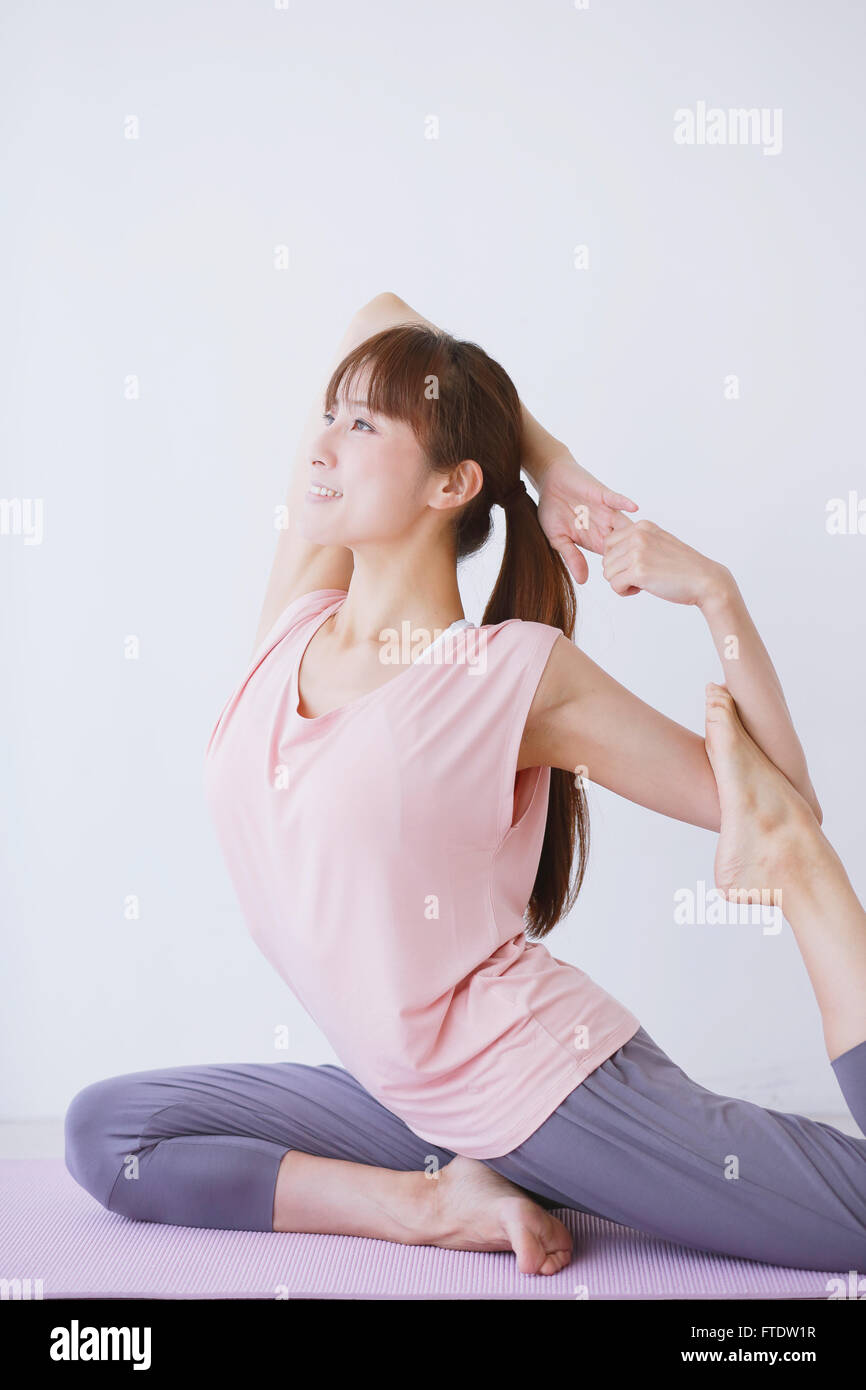 Young Japanese woman practicing yoga Stock Photo - Alamy