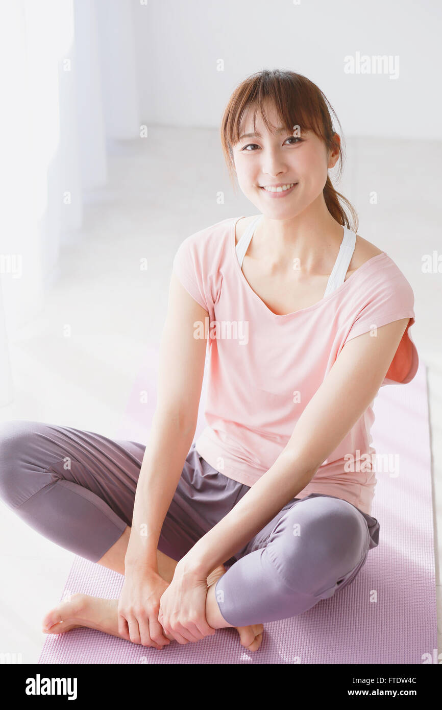 Young Japanese woman practicing yoga Stock Photo - Alamy