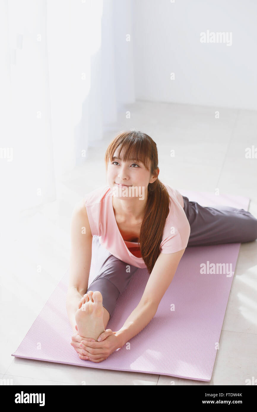 Young Japanese woman practicing yoga Stock Photo - Alamy