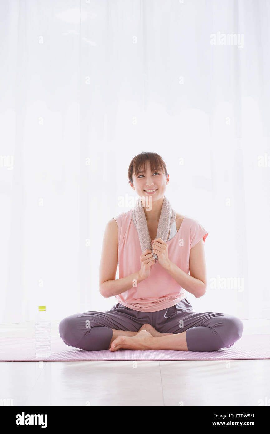 Young Japanese woman practicing yoga Stock Photo - Alamy