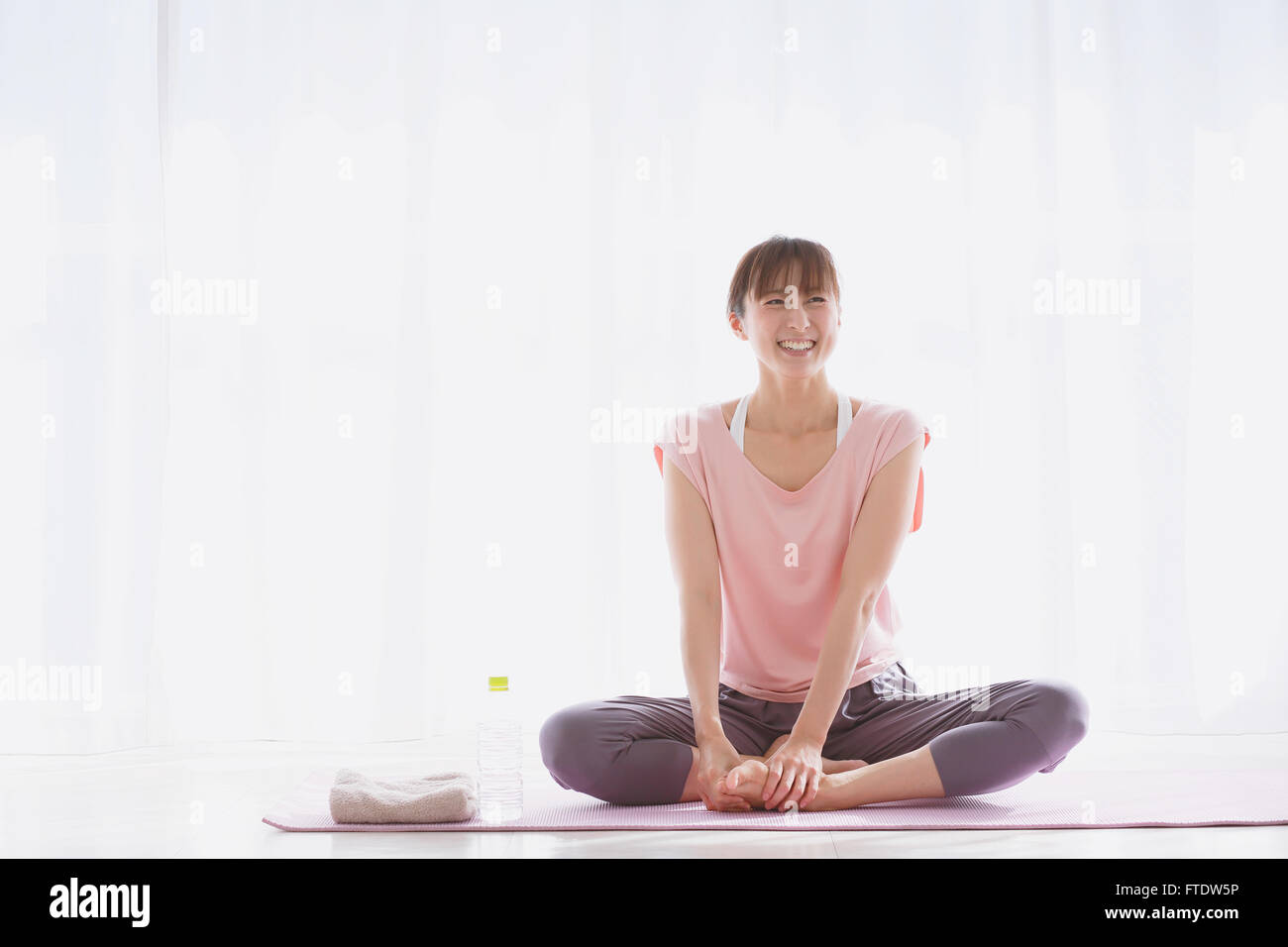 Young Japanese woman practicing yoga Stock Photo - Alamy