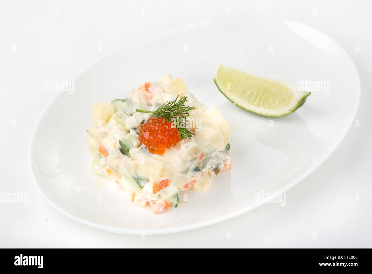 Russian salad on white background Stock Photo - Alamy