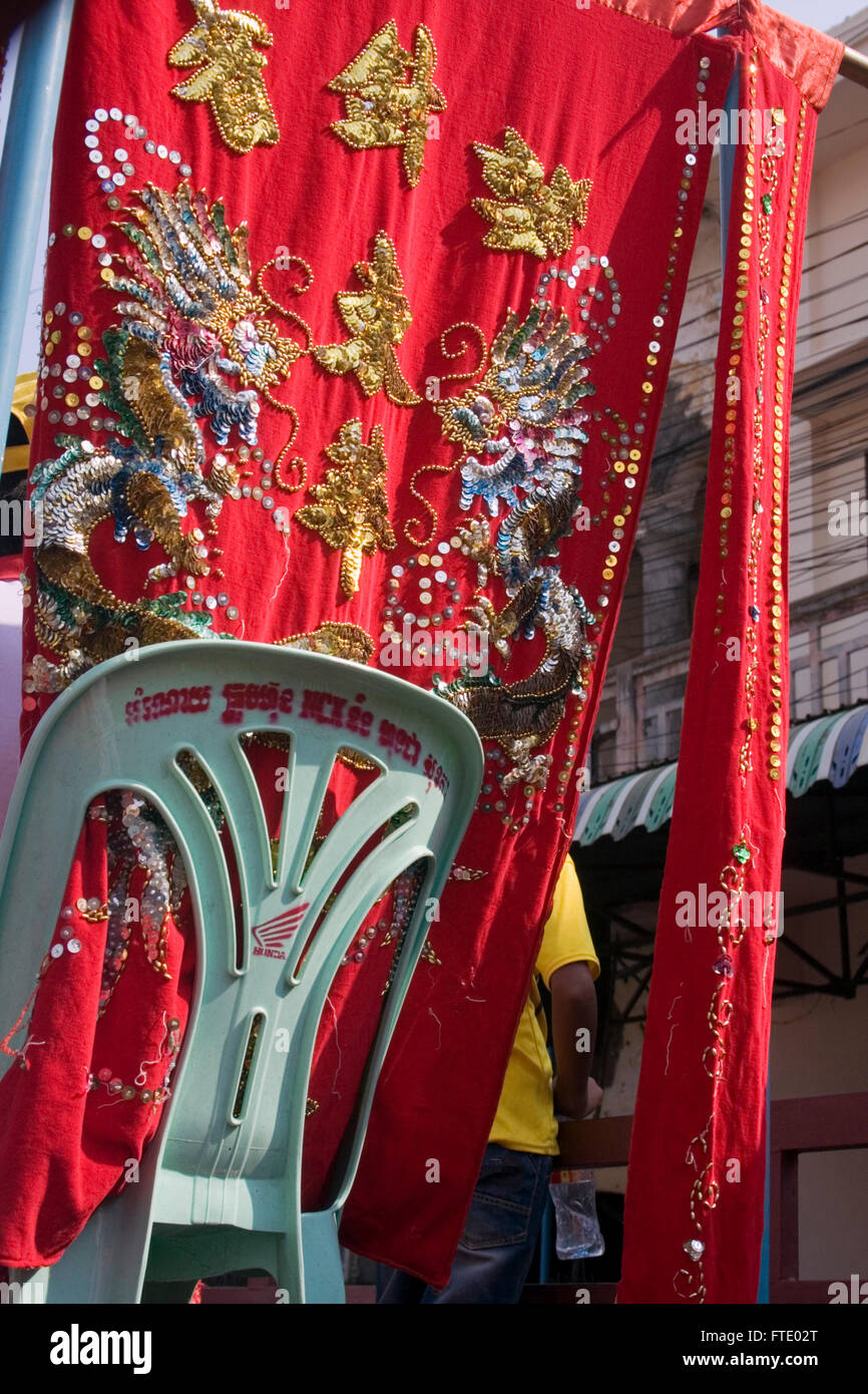 Bright embroidered cloth is part of the celebration during Chinese New ...