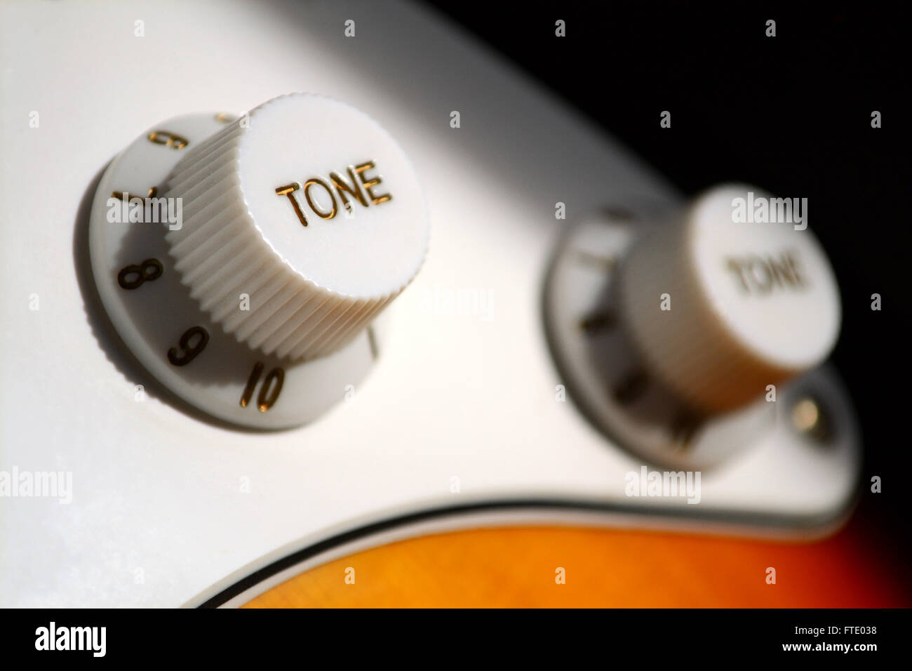 Tone knobs on an electric guitar Stock Photo - Alamy