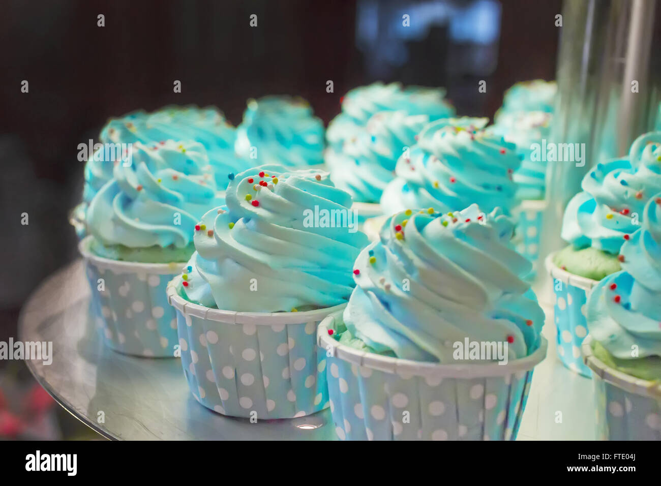 Blue cupcake with Cream and topping on Top Stock Photo - Alamy
