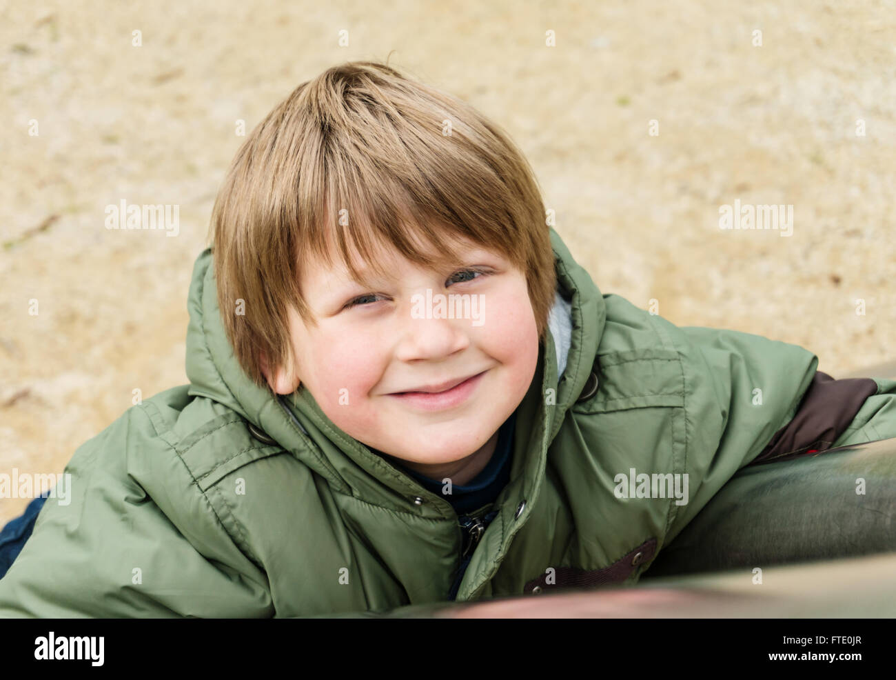 Cheerful blond boy at outdoor playground Stock Photo - Alamy