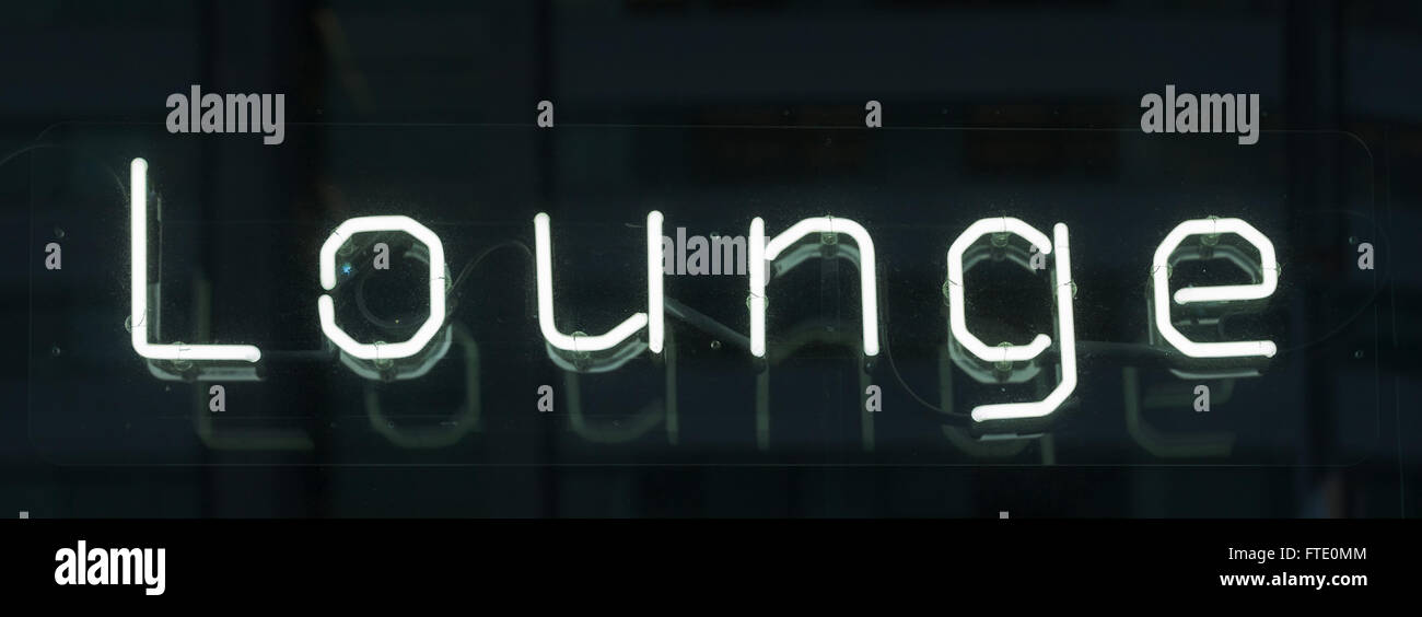 Illuminated neon sign Lounge in a window Stock Photo - Alamy