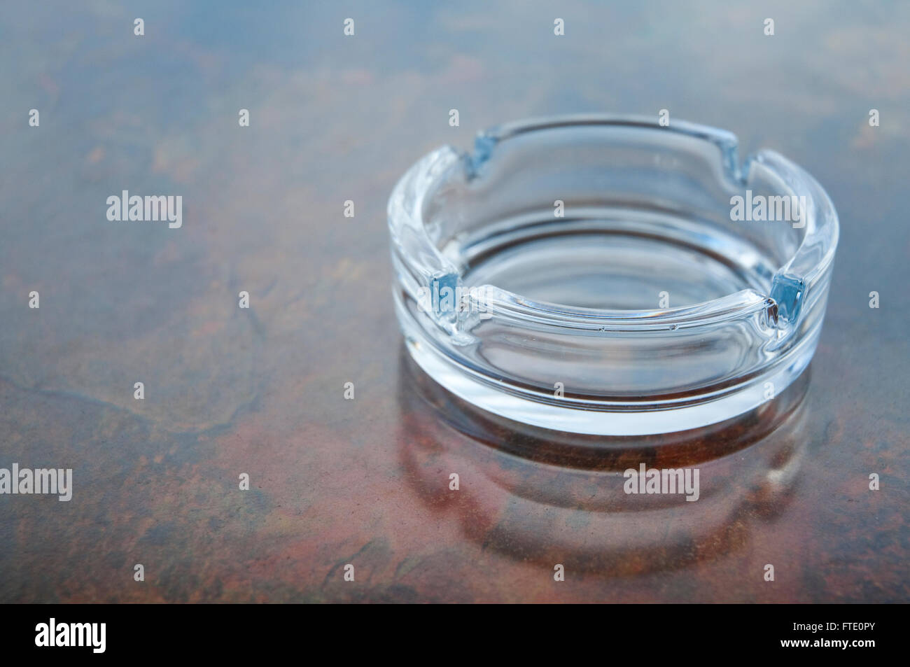 An empty glass ashtray. Close view Stock Photo - Alamy
