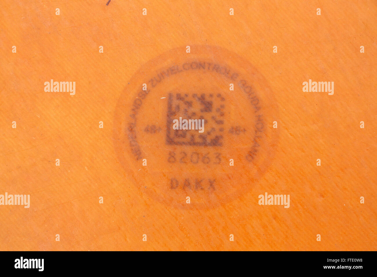Close up of inspection control mark on a wheel of Gouda cheese in Gouda ...