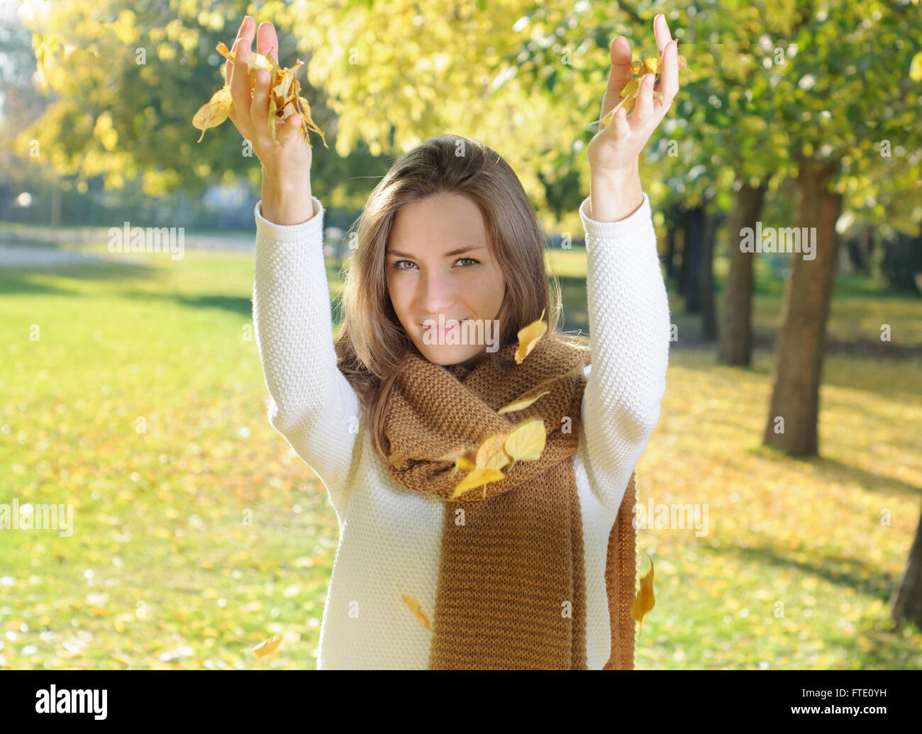 Young woman portrait in autumn fall park Stock Photo - Alamy