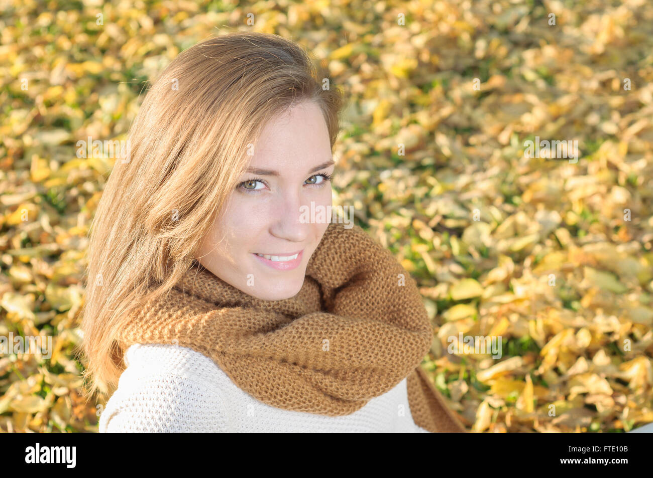 Young woman portrait in autumn fall park Stock Photo - Alamy