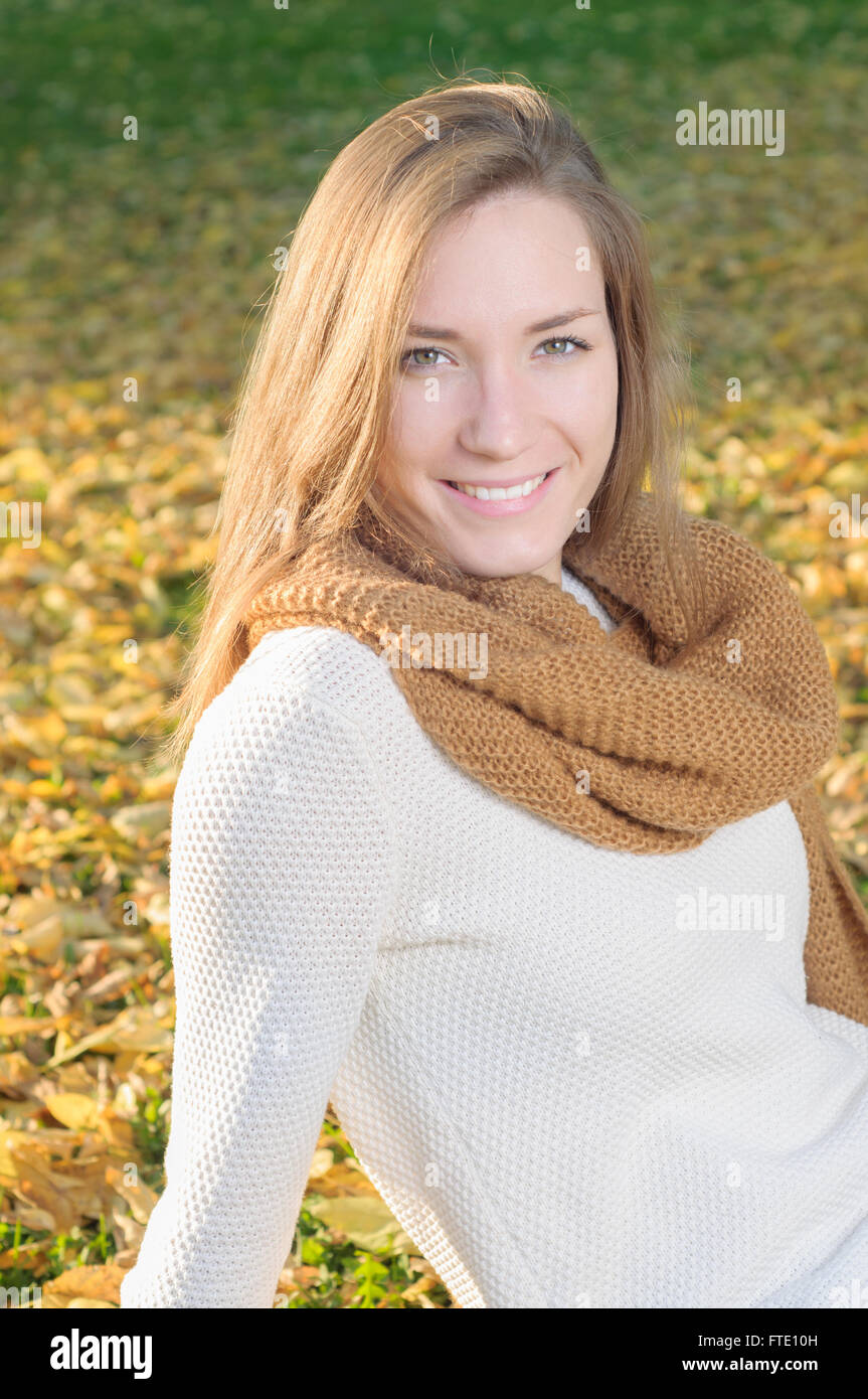 Young woman portrait in autumn fall park Stock Photo - Alamy