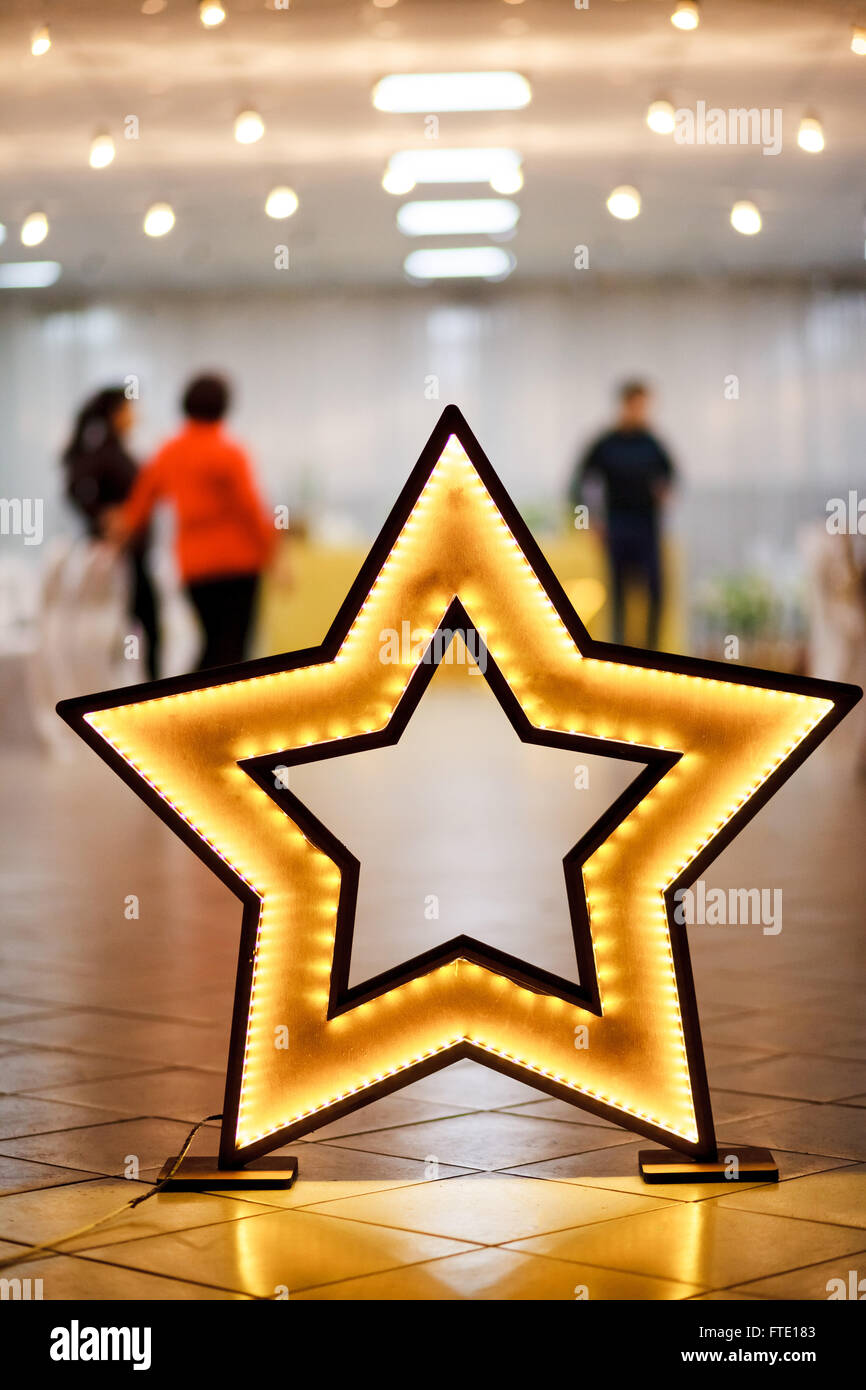 Decorative star made of wood with LED backlight on floor Stock Photo ...