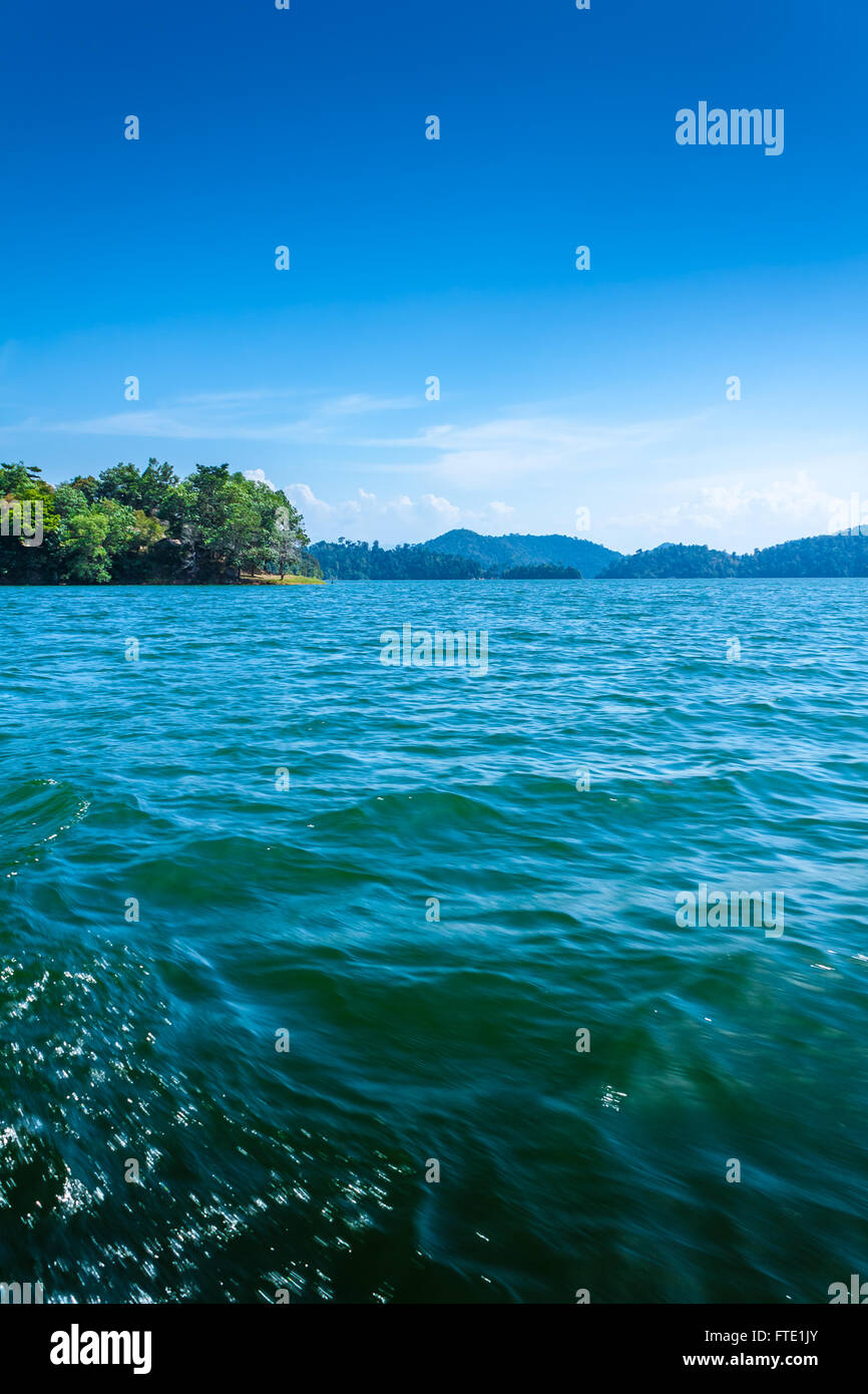 Tropical lake and islands in clear blue sky. Belum resort, Banding ...