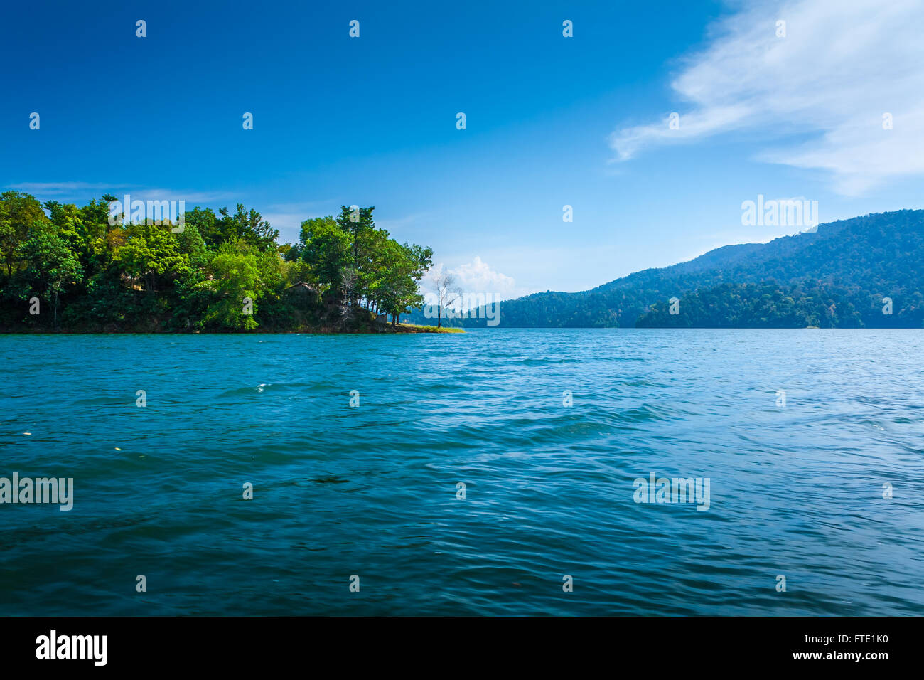 Tropical lake and islands in clear blue sky. Belum resort, Banding ...
