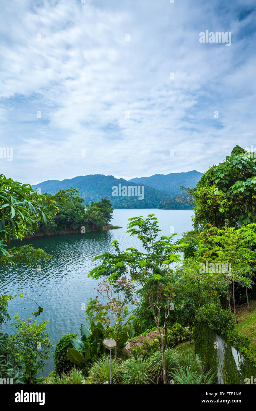 Tropical lake, forest and islands in cloudy overcast day. Belum resort ...