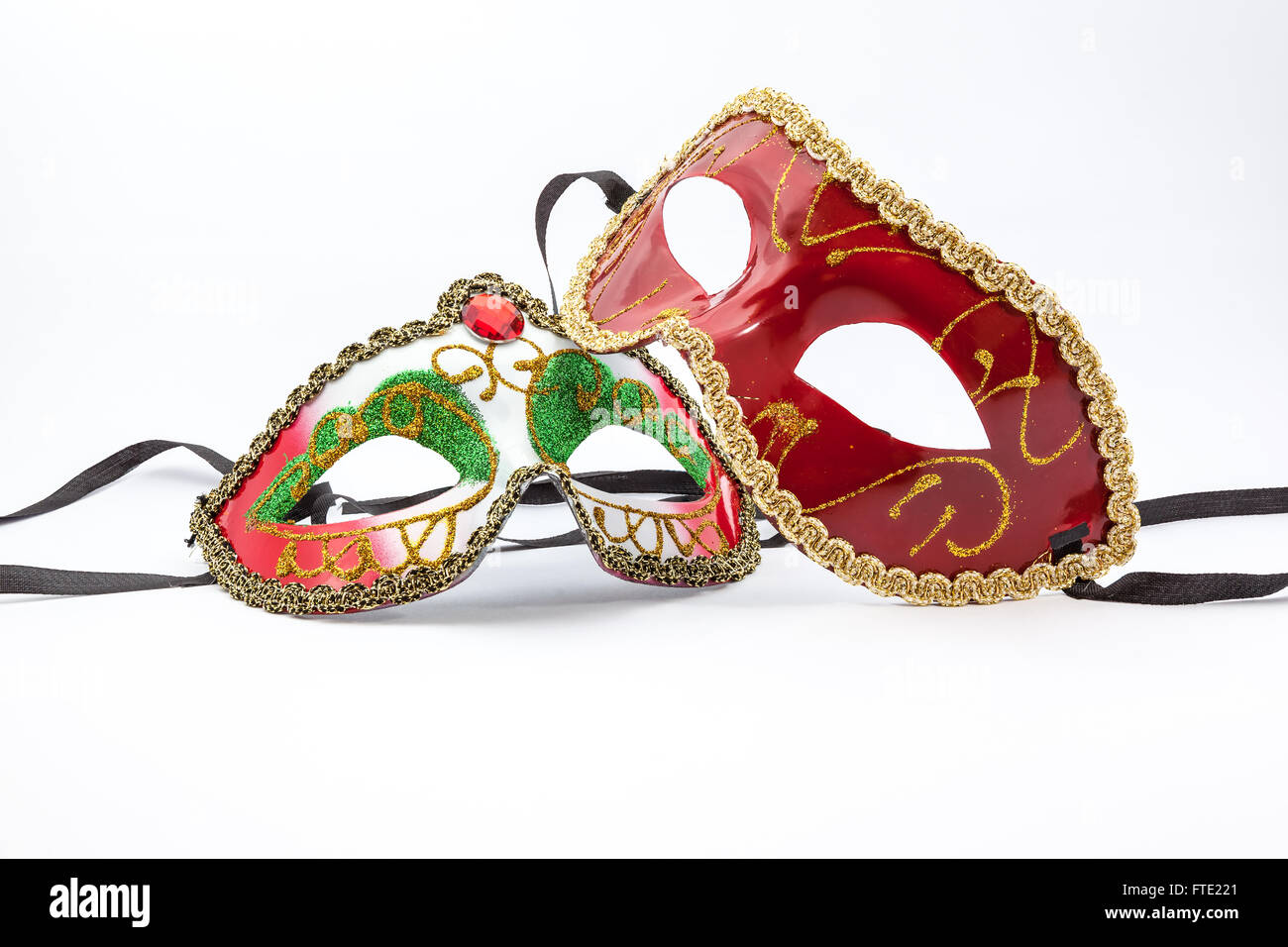 an carnival mask on an white background with black ribbons Stock Photo ...