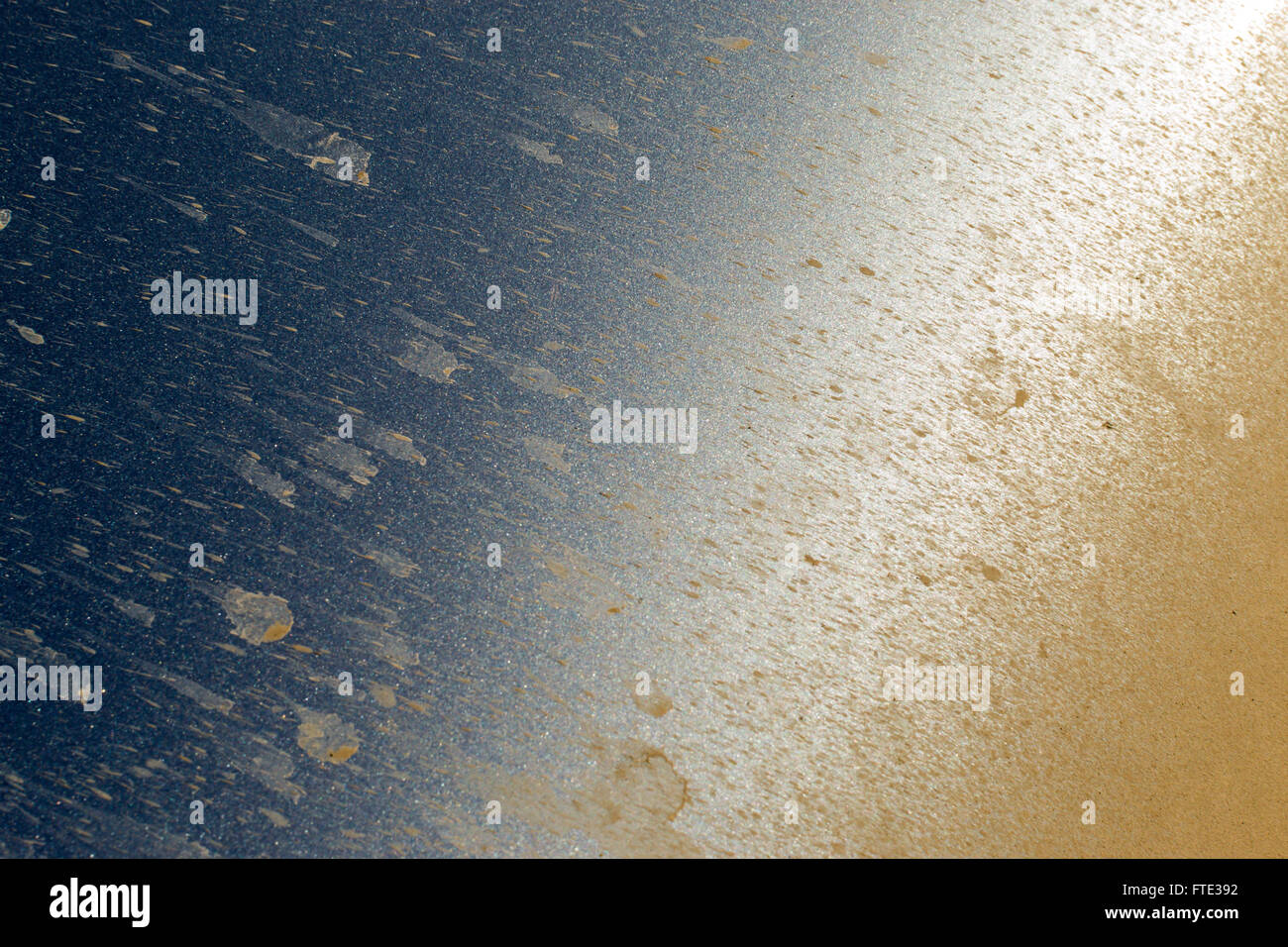 Dirty mud splashes make dynamic abstract trailing patterns as they dry ...
