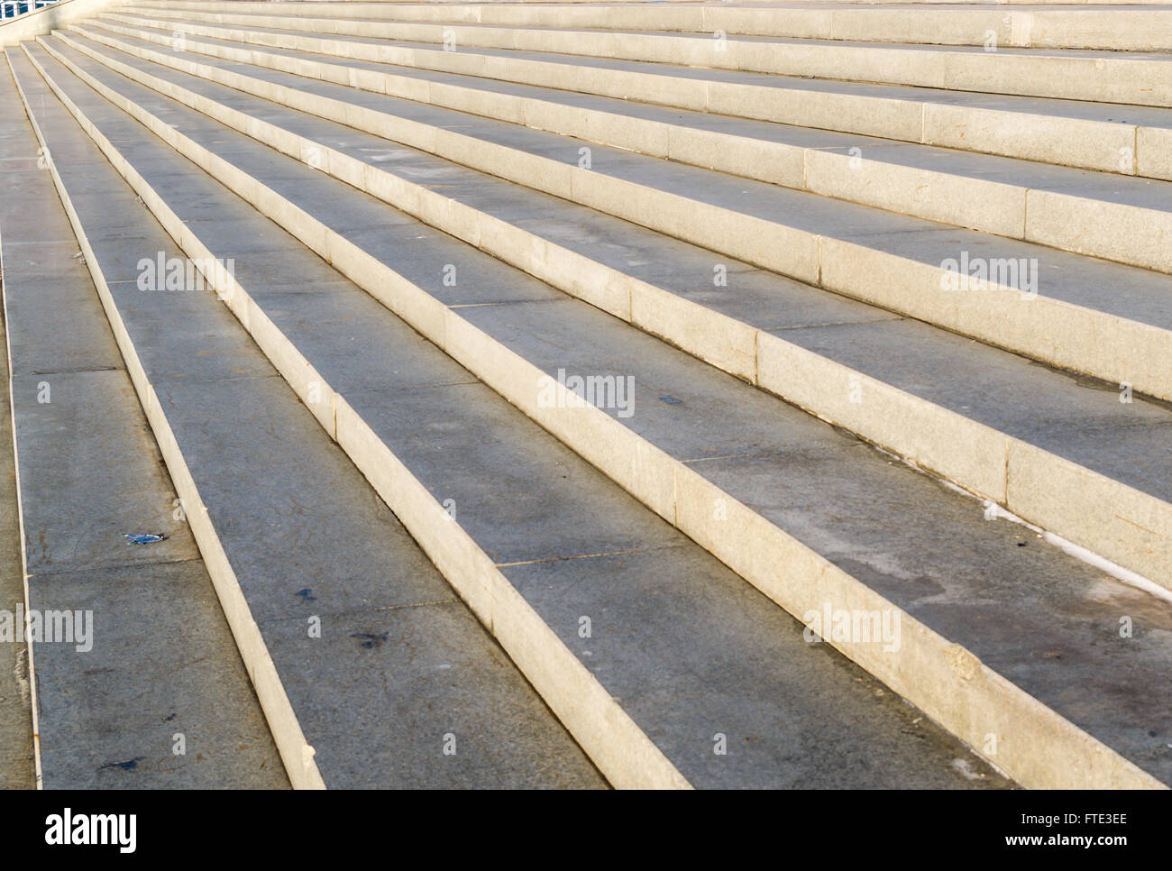 Lines of concrete urban steps create abstract diagonal patterns in a ...