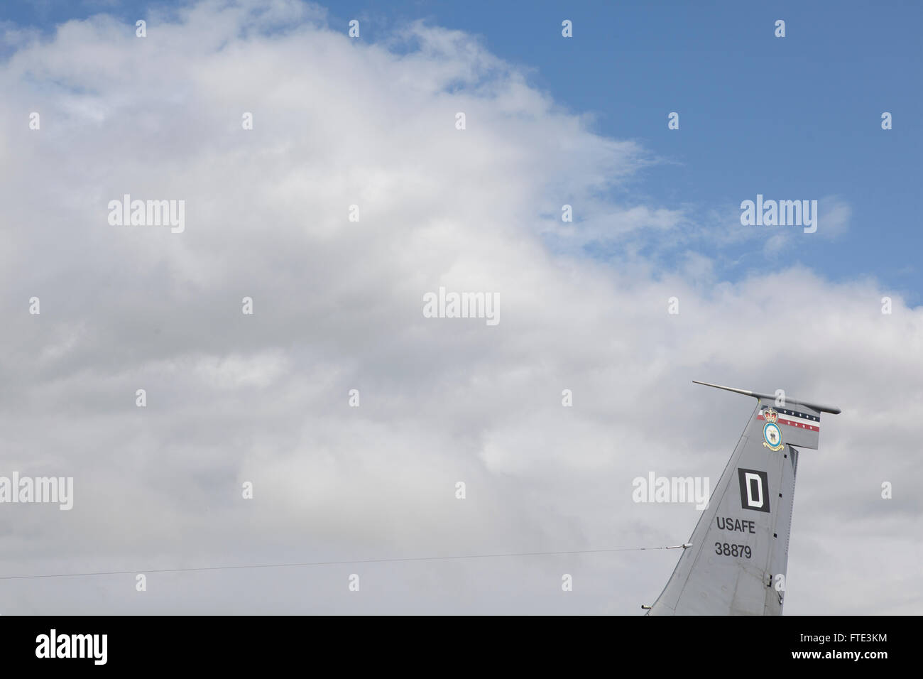 The tail of an aeroplane or fighter aircraft as it sits on the runway ...
