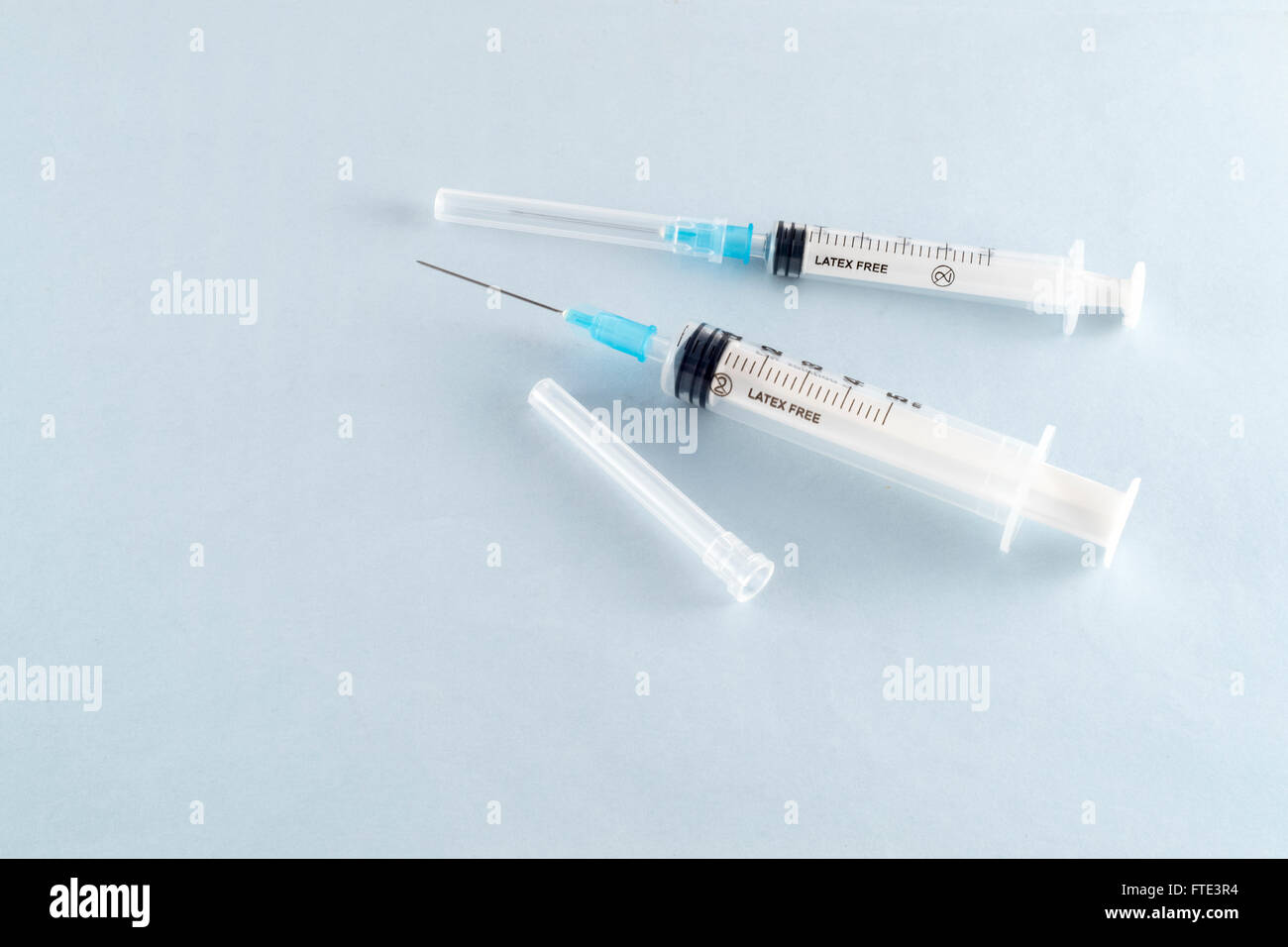 Injection needle blue background hi-res stock photography and images ...