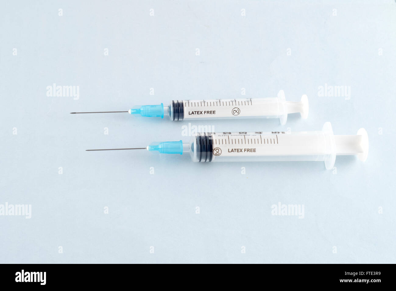 Injection needle blue background hi-res stock photography and images ...