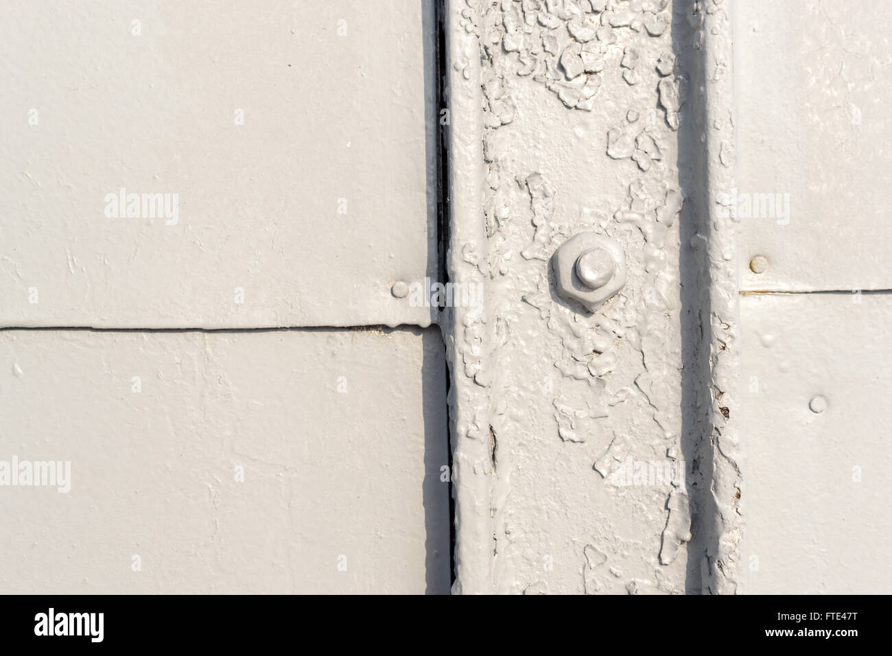 Close up architectural image of grey painted bolts used for securing ...